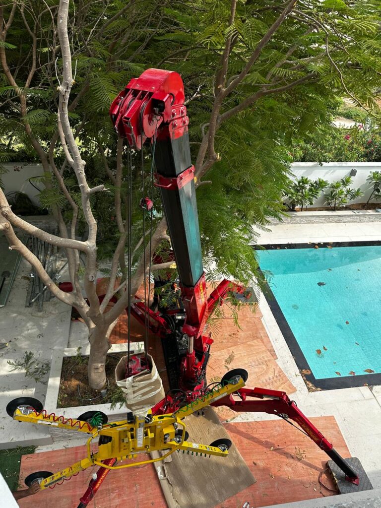 GLAZING BY A POOL AT A PRIVATE VILLA WITH THE URW-295 MINI SPIDER CRANE ...